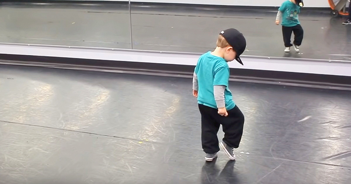 The little boy listened to his favorite music and started to dance very ...